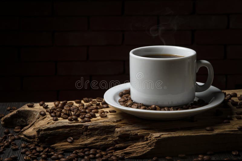 Cup of Coffee on a Rustic Wood. Coffee Grains Stock Photo - Image of ...