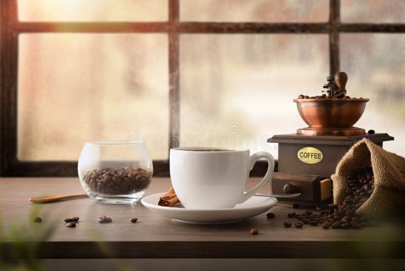 Cup Coffee Sack and Grinder on Window Ledge Front View Stock Image ...