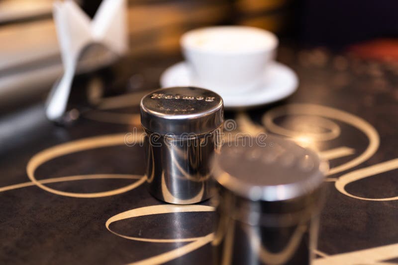Cup of Coffee with Salt and Pepper Shaker on Table in Coffee Shop Cafe ...