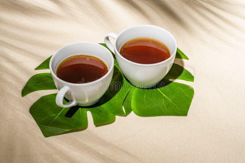 Cup Coffee on Sand of Tropical Beach Under Palm Tree Branches Shadow ...