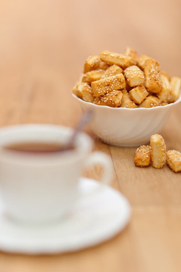 Cup coffee, sesame cookies stock photo. Image of drink - 21991430