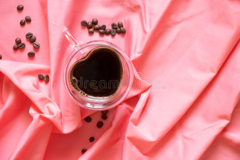 A Cup of Coffee in the Shape of a Heart on a Table on a Tablecloth ...