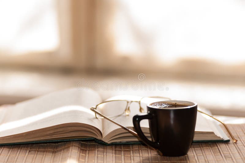 Cup of Coffee, Standing Next To an Open Book Stock Image - Image of ...