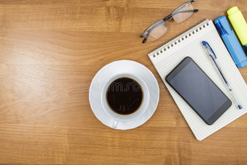 Cup of Coffee on the Table with the Usual Supplies for Office Work ...