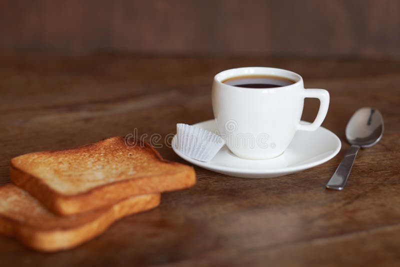 A cup of coffee and toast. stock photo. Image of creamy - 66475234