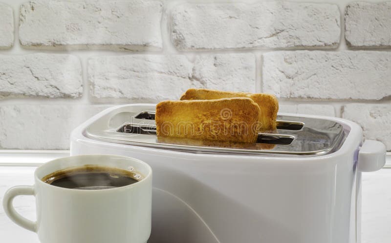A Cup of Coffee and Toast in a Toaster2 Stock Image - Image of plate ...