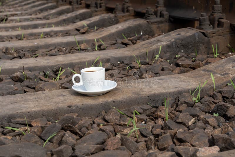 A Cup of Coffee on the Train Tracks Stock Photo - Image of blur, train ...
