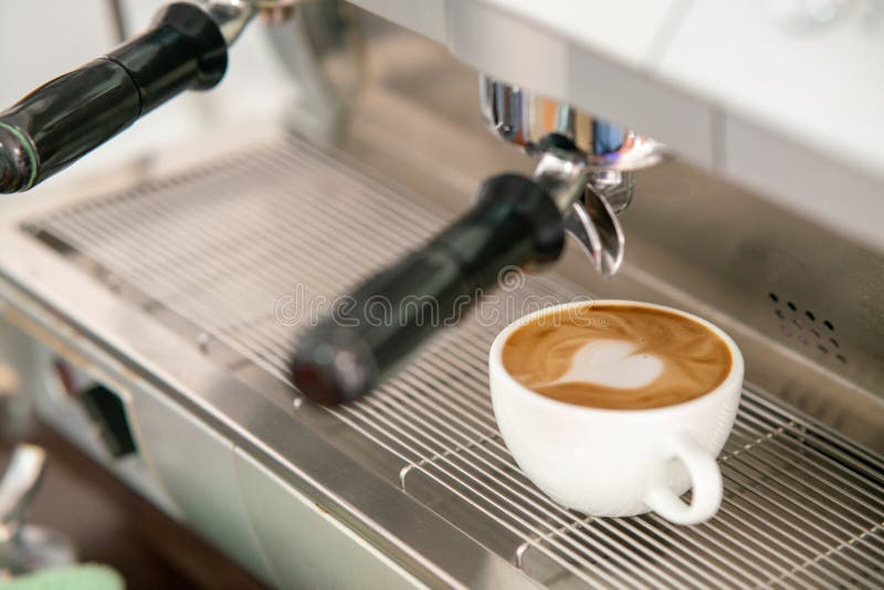 Cup of Coffee Under the Coffee Machine Stock Photo - Image of white ...