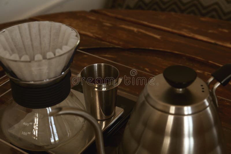 Cup with Coffee, Wave Dripper and Kettle on Wooden Table in Cafe Stock ...