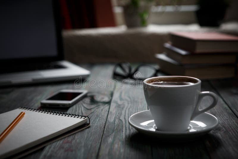 A Cup of Coffee in the Workplace on a Wooden Table. Stock Photo - Image ...