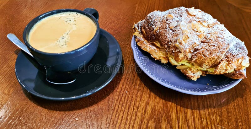 Cup of Delicious Aromatic Coffee and Bun with Nuts for Breakfast Stock ...