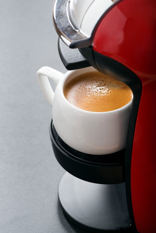Cup of Espresso in the Coffee Machine, Vertical Stock Photo - Image of ...
