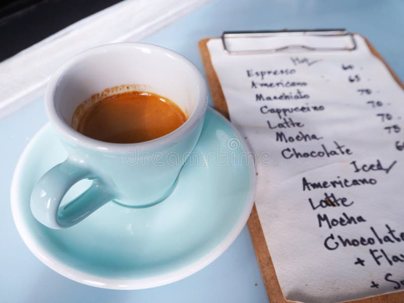 Cup of Espresso Coffee Ready To Serve with Coffee Menu on the Blue ...