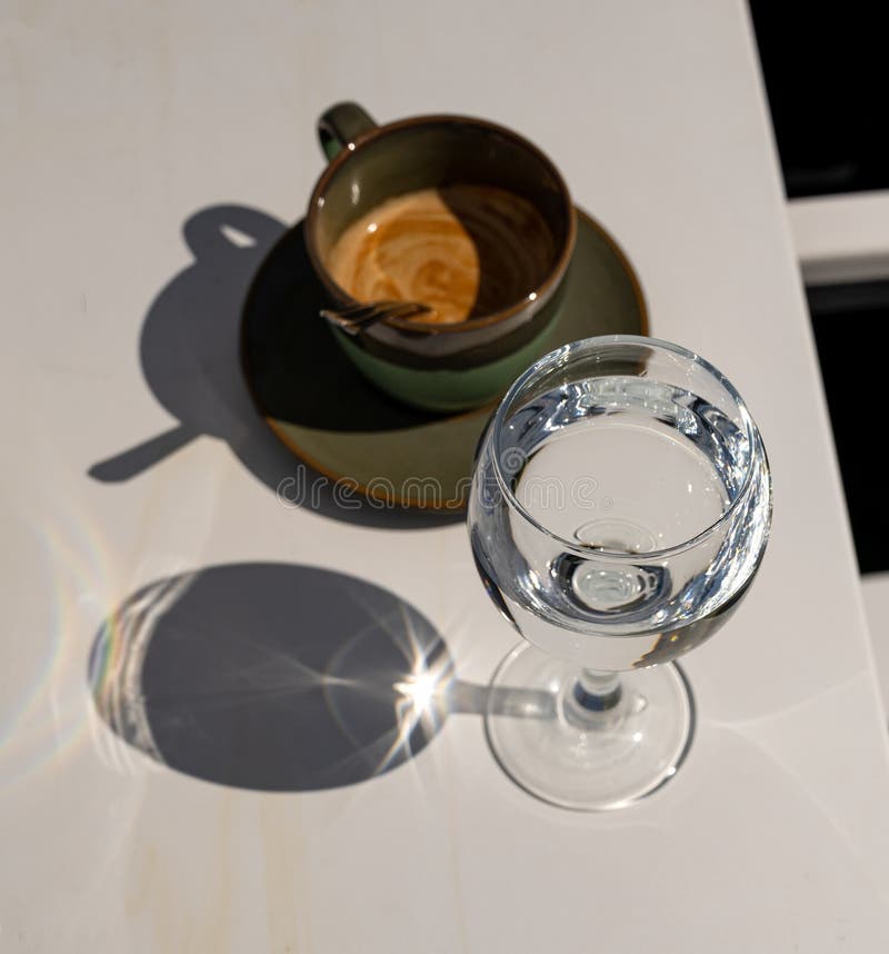 Cup of Espresso and Glass of Water on the Table in Cafe Stock Image ...