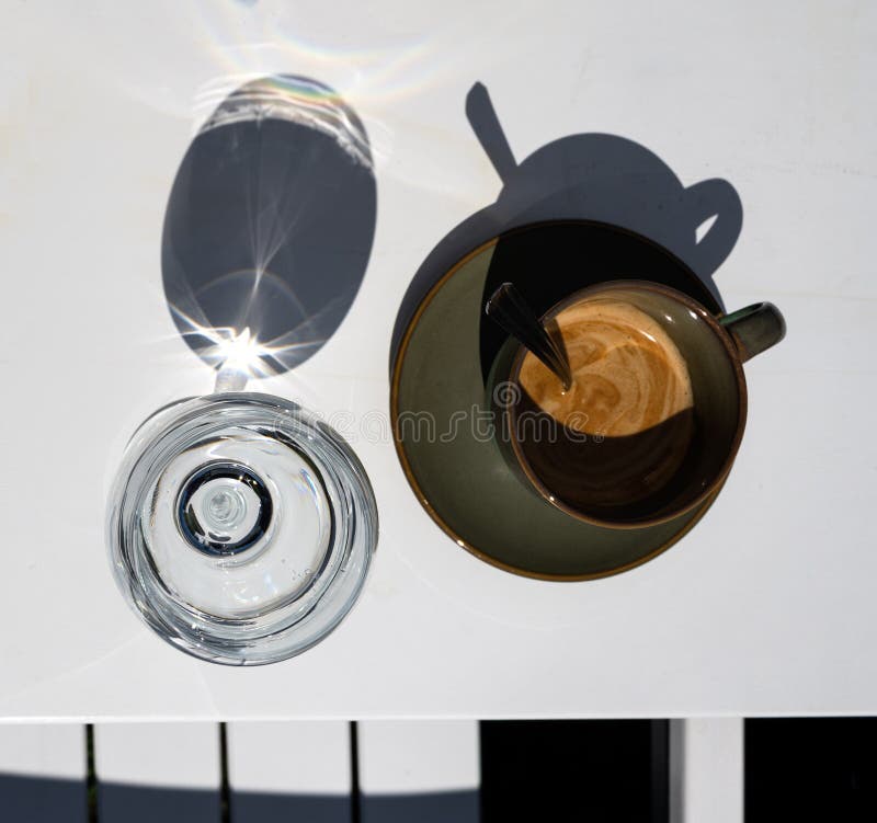 Cup of Espresso and Glass of Water on the Table in Cafe Stock Photo ...
