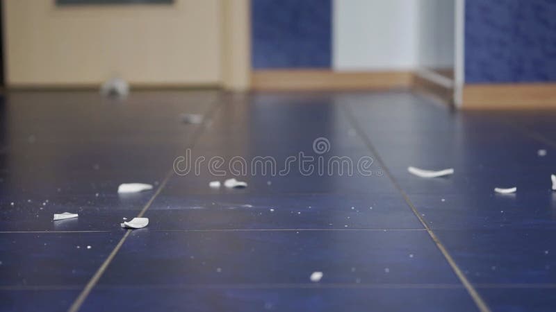 The Cup Falls To the Floor and Breaks into Small Pieces Stock Video ...