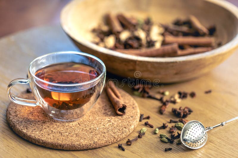 Cup of Freshly Brewed Black Tea, Different Types of Spices on Wooden ...