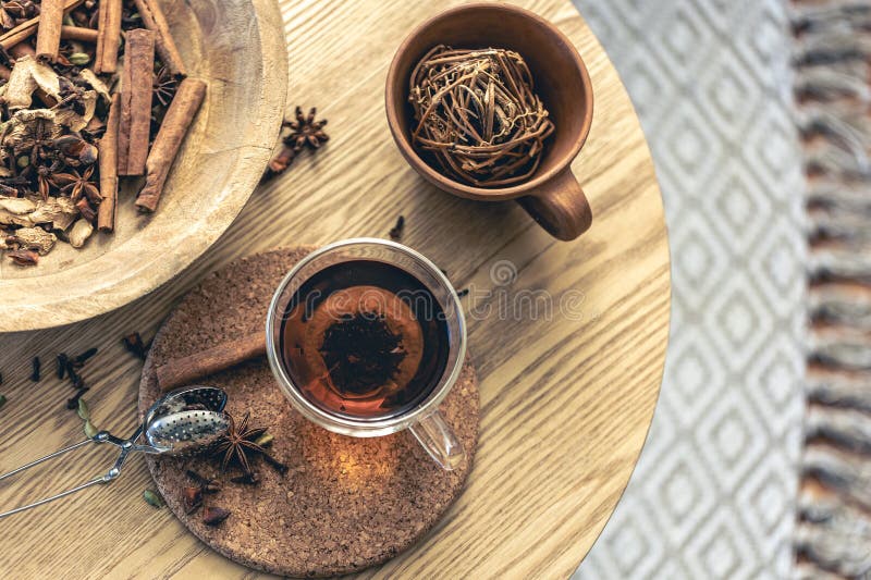 Cup of Freshly Brewed Black Tea, Different Types of Spices on Wooden ...