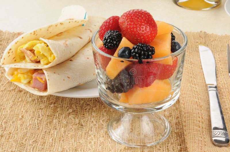 Cup of Fruit and Breakfast Burritos Stock Photo - Image of horiztontal ...