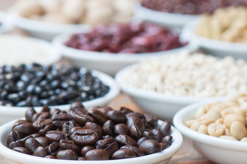 Cup full of coffee beans stock photo. Image of saucer - 77769816