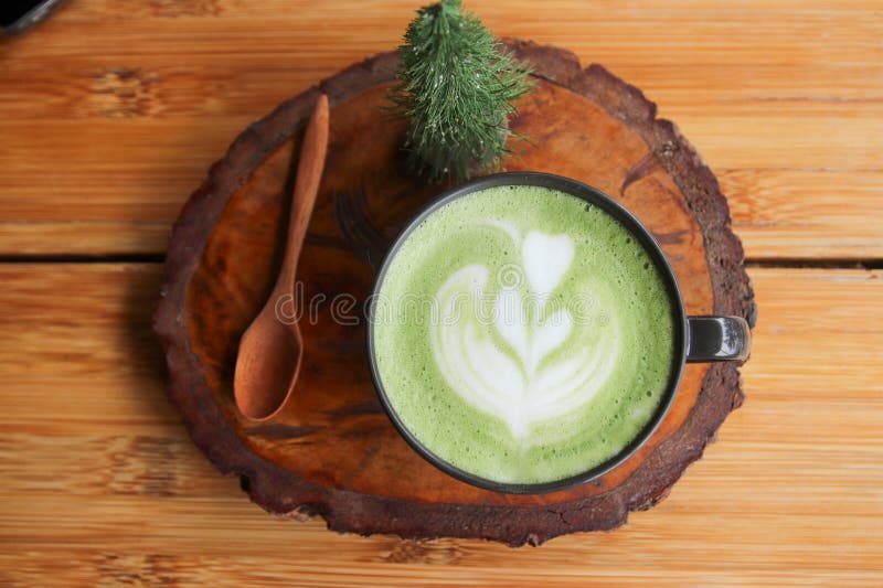 Cup of Green Milk Tea on a Wooden Stand Stock Image - Image of matcha ...