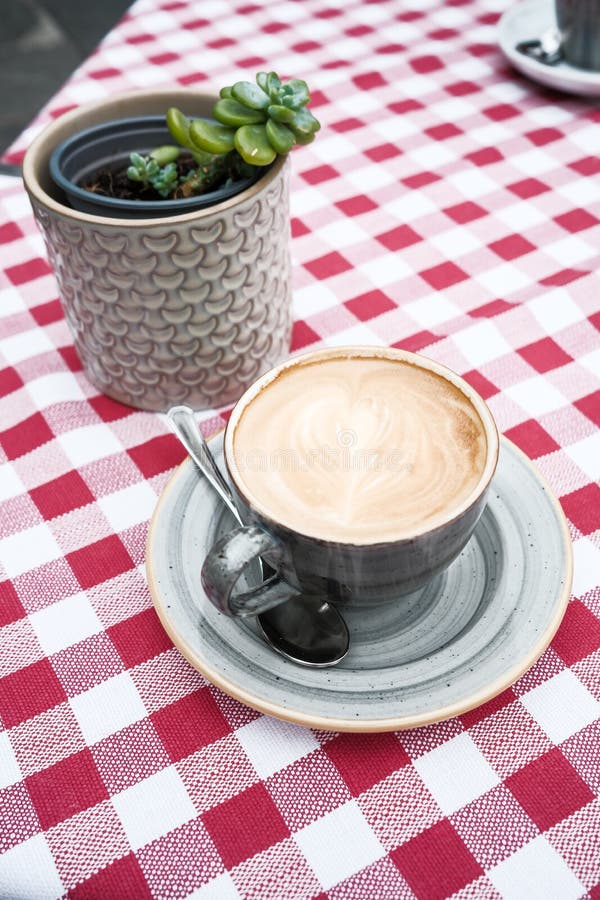 A Cup of Hot Caffe Latte on an Outdoor Cafe Table Stock Image - Image ...