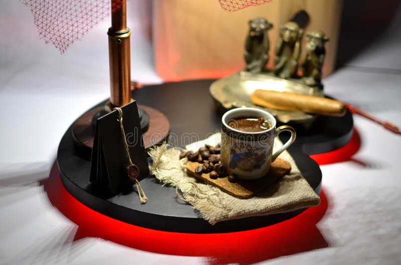 Cup of Hot Coffee with Coffee Beans and Copper Ashtray with a Big Cigar ...