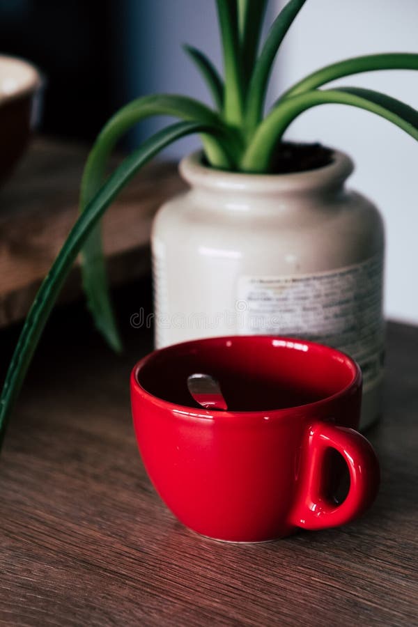 Cup of Hot Coffee in Red Ceramic on the Kitchen Table Stock Photo ...