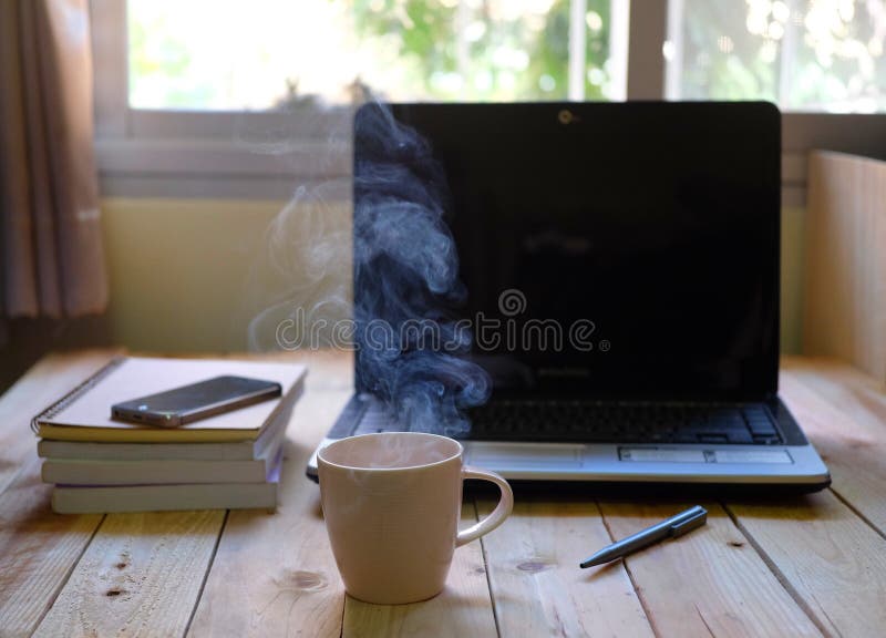 A Cup Of Hot Coffee Smoke And A Book, Computer On Wood Table Stock ...