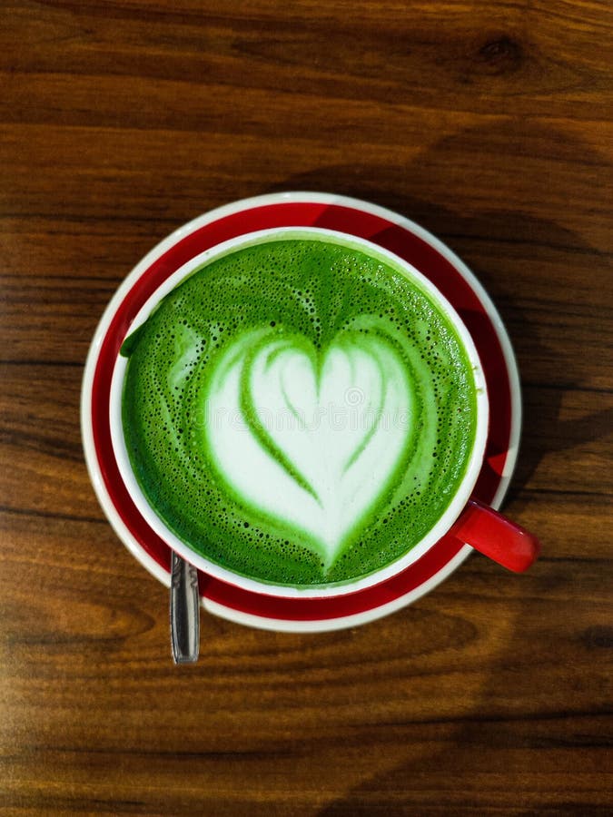 A cup of hot matcha latte stock photo. Image of matc - 243683512