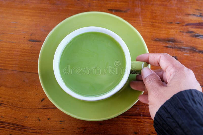 Cup of Hot Milk Green Tea in Hand Stock Photo - Image of elements, herb ...