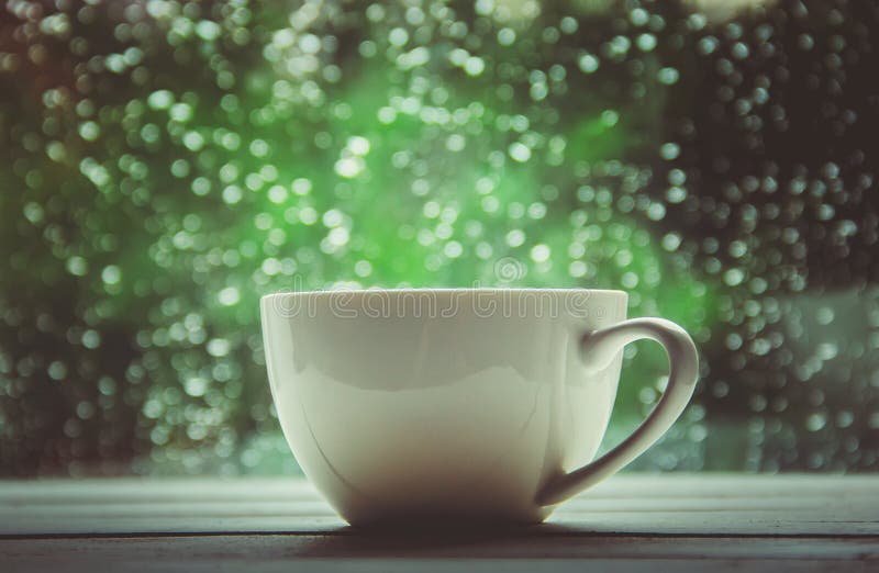 A Cup of Hot Tea in the Background Rain Outside the Window. Stock Photo ...