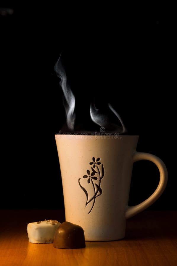 Cup of hot tea or coffee stock image. Image of praline - 14385157