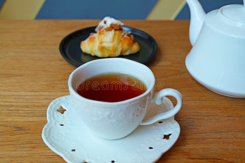 Hot Tea with a Plate of Almond Croissant in the Backdrop Stock Photo ...