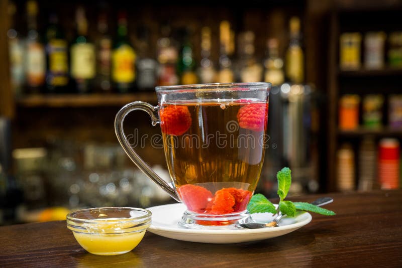 Cup of Hot Winter Raspberry Tea with Cinnamon Sticks Stock Photo ...