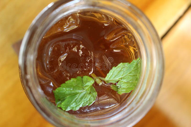 A Cup of Ice Lemon Tea with Its Leaf, Served at a Cafe Stock Photo ...