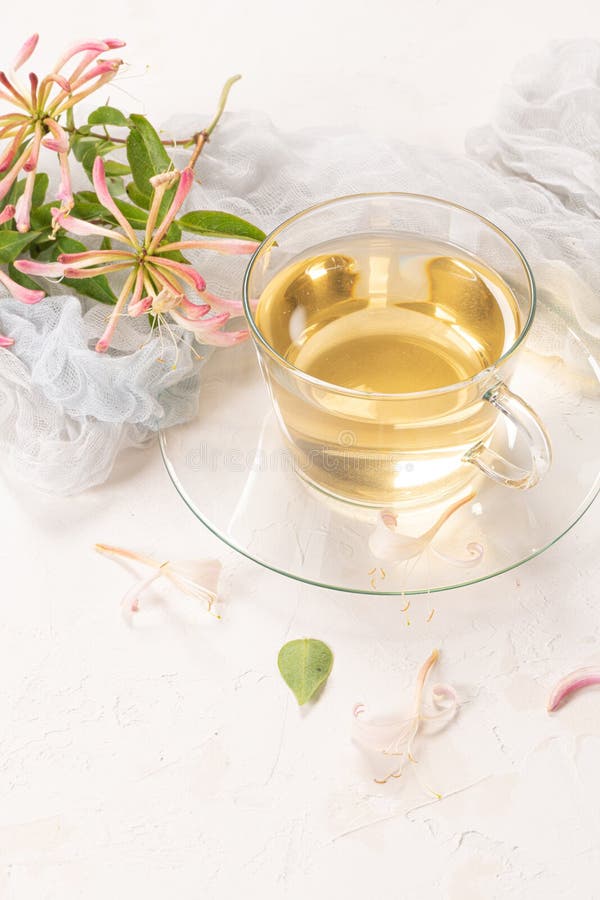 A Cup of Jasmine Tea and Jasmine Flowers on a White Background Stock ...