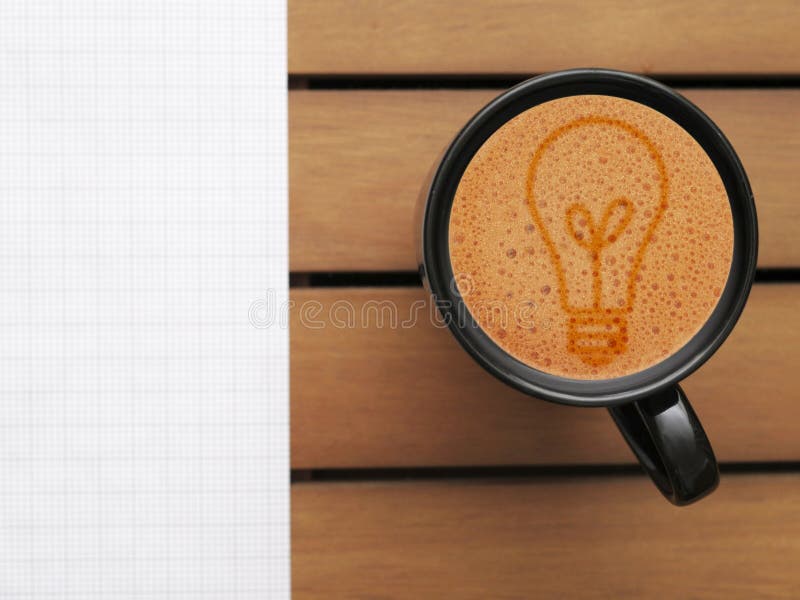 Cup with Latte in a Black Cup and a Piece of Squared Paper on a Wooden ...