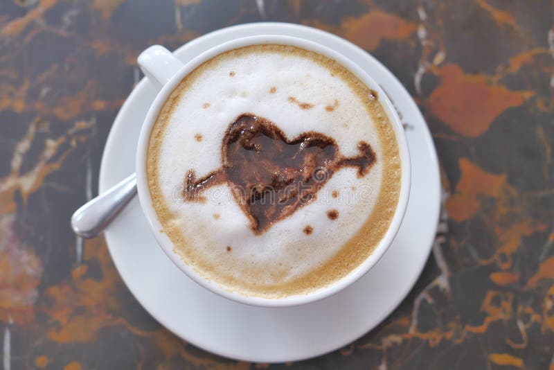 A Cup of Latte with Heart Art Isolated with Wooden Background. Stock ...