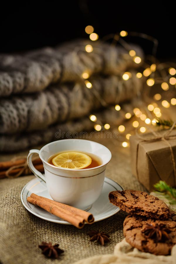 A Cup of Lemon Tea with Selective Focus on the Table with Cinnamon ...