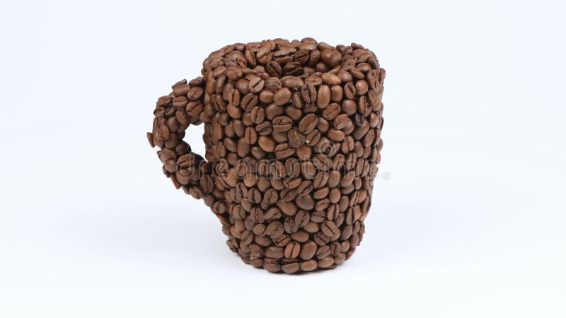 A Cup Made of Coffee Beans on White. Side View. Loop Motion Stock Video ...
