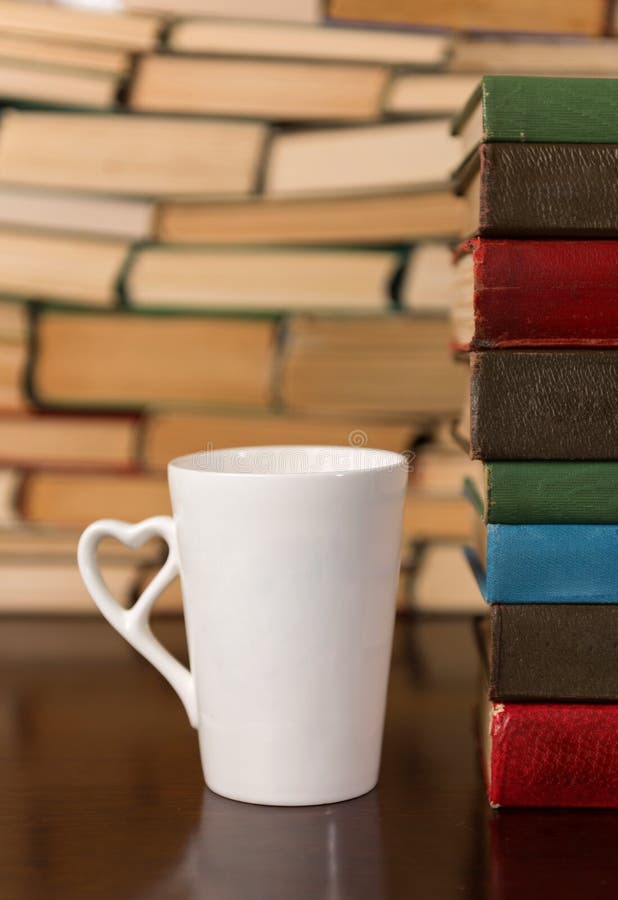 Cup and Many Books on Table Stock Photo - Image of dictionary, library ...