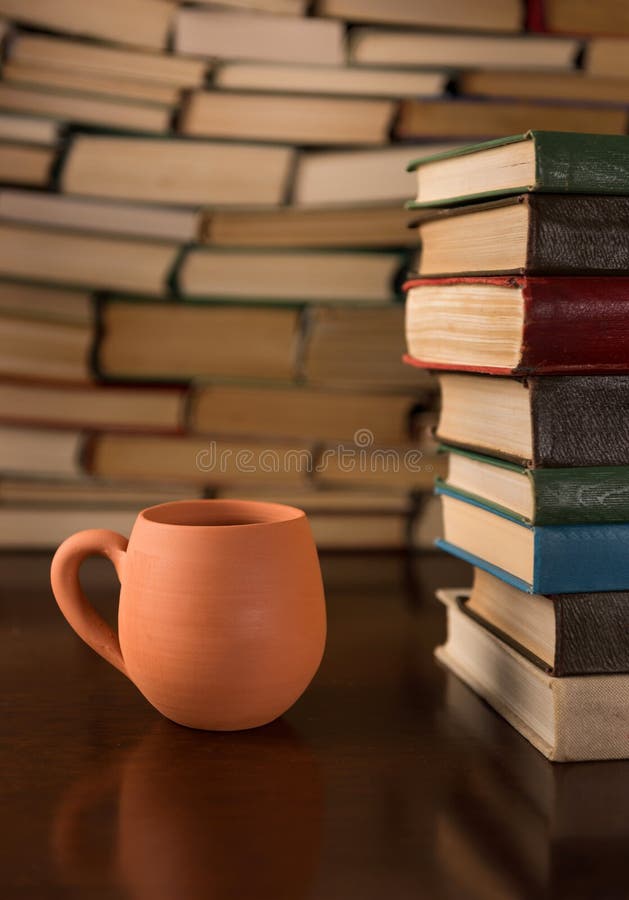 Cup and Many Books on Table Stock Photo - Image of dictionary, library ...