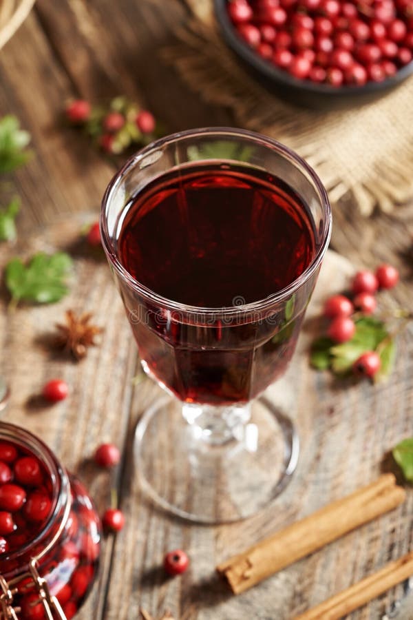 A Cup of Medicinal Wine Made of Fresh Hawthorn Berries and Spices Stock ...