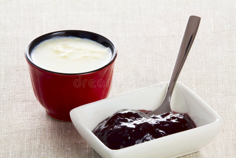 A cup of milk and jam stock image. Image of tasty, morning - 33324923