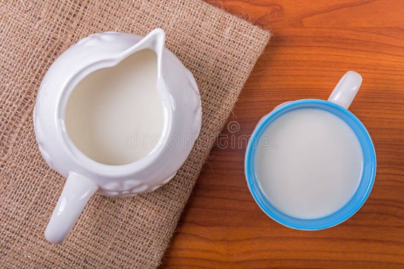 Cup of Milk on Table with Juta Cloth and Jug Stock Image - Image of ...