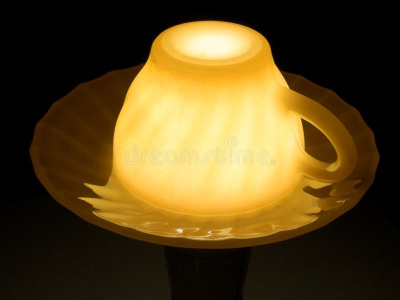 Cup over a candle stock photo. Image of candle, saucer - 1353524
