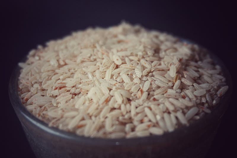 A cup of polished red rice stock photo. Image of pantry - 331635088
