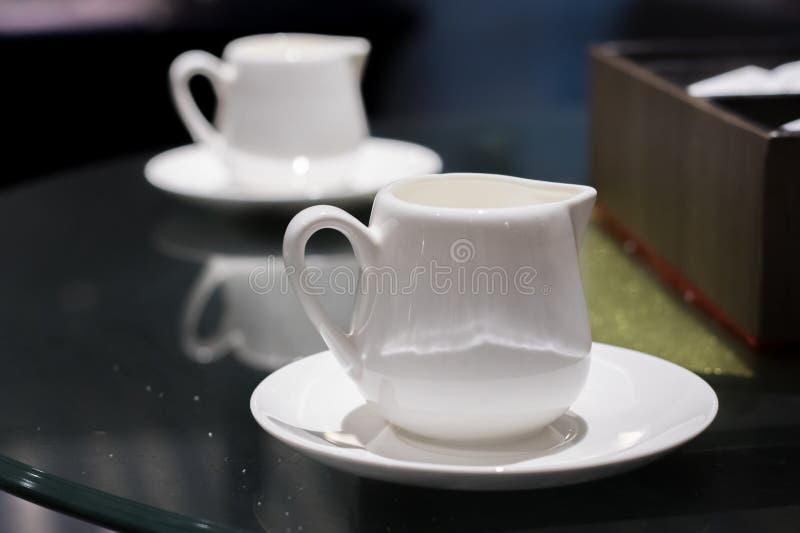 Cup of Pouring Cream on the Table in the Cafe Stock Image - Image of ...