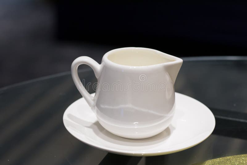Cup of Pouring Cream on the Table in the Cafe Stock Photo - Image of ...